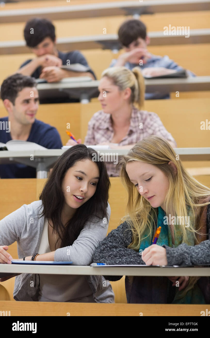 Students learning and talking in a lecture hall Stock Photo - Alamy