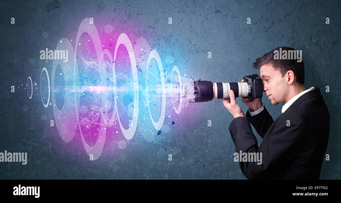 Photographer making photos with powerful light beam Stock Photo - Alamy