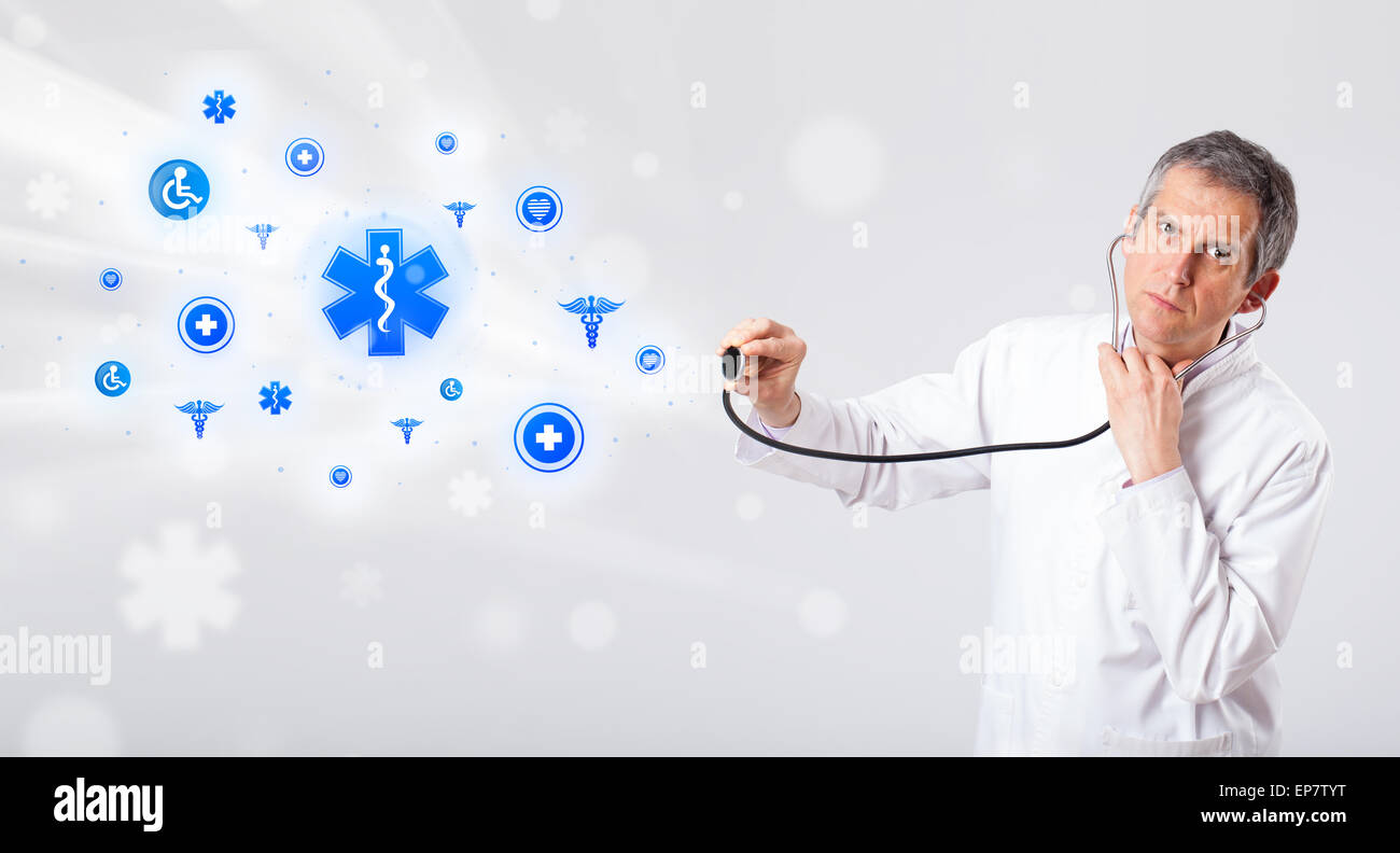 Doctor with blue medical icons Stock Photo - Alamy