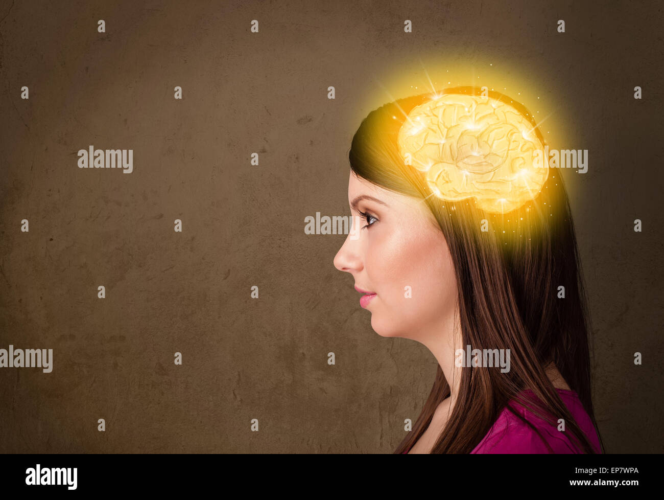 Young girl thinking with glowing brain illustration Stock Photo - Alamy