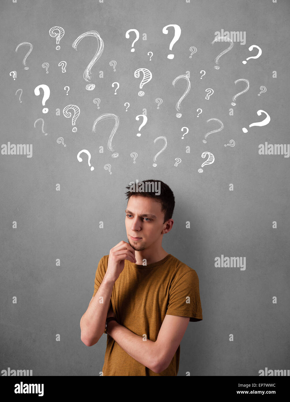 Young man with question marks above his head Stock Photo - Alamy