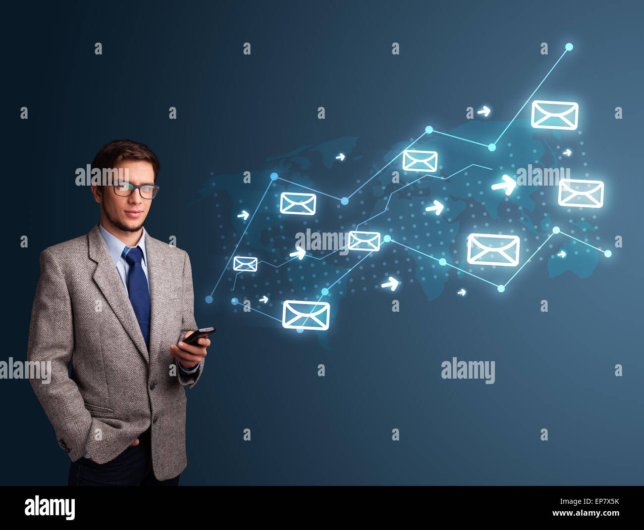 Young man holding a phone with arrows and message icons Stock Photo - Alamy
