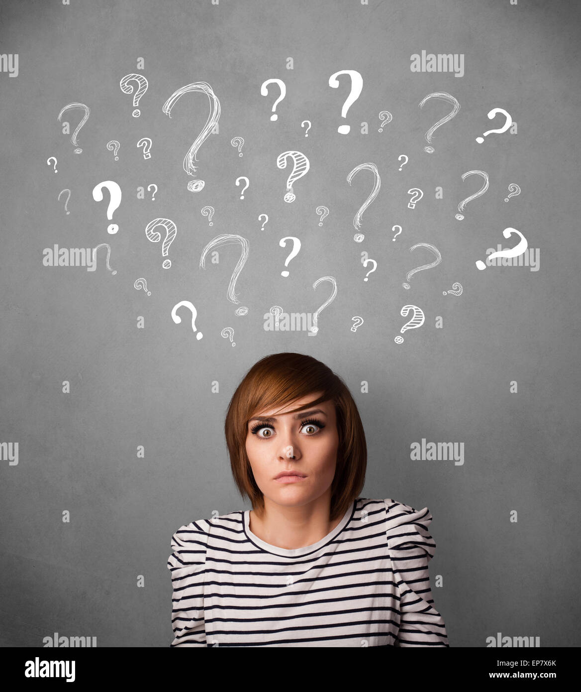 Young woman with question marks above her head Stock Photo - Alamy