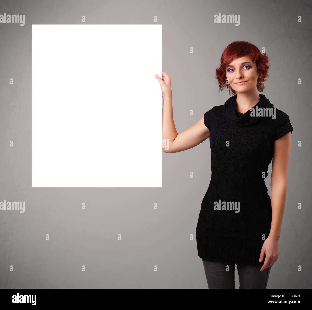 Young woman presenting white paper copy space Stock Photo - Alamy