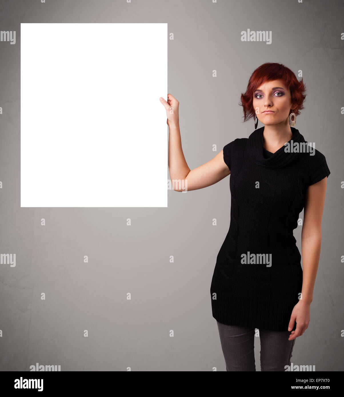 Young woman presenting white paper copy space Stock Photo - Alamy