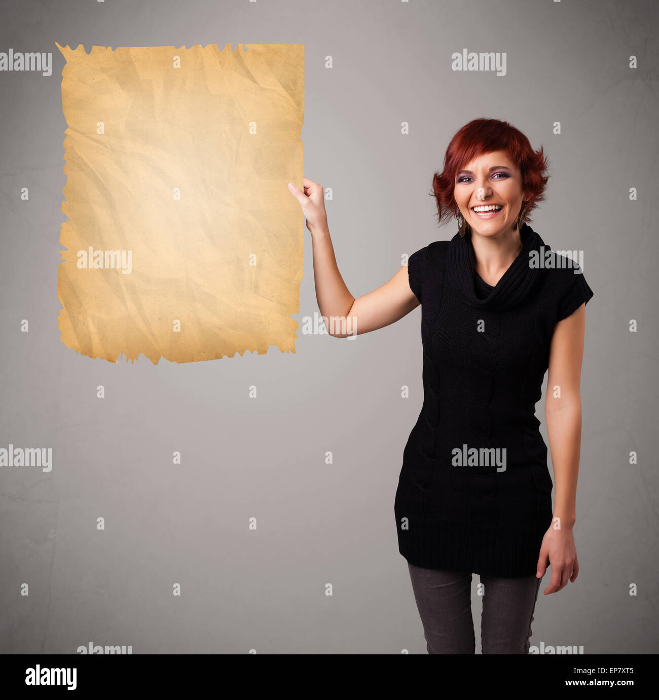Young girl presenting old paper copy space Stock Photo - Alamy