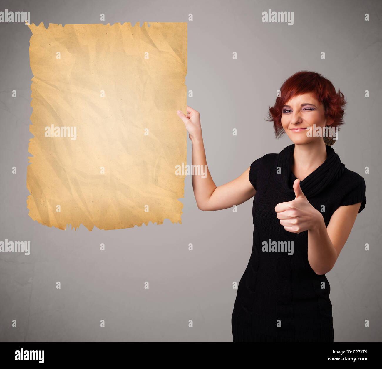 Young girl presenting old paper copy space Stock Photo - Alamy