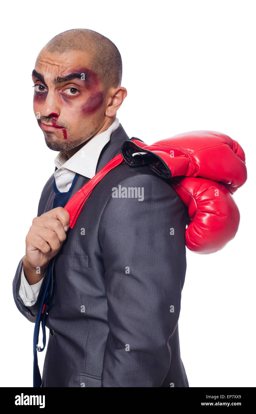 Badly beaten businessman with boxing gloves Stock Photo - Alamy
