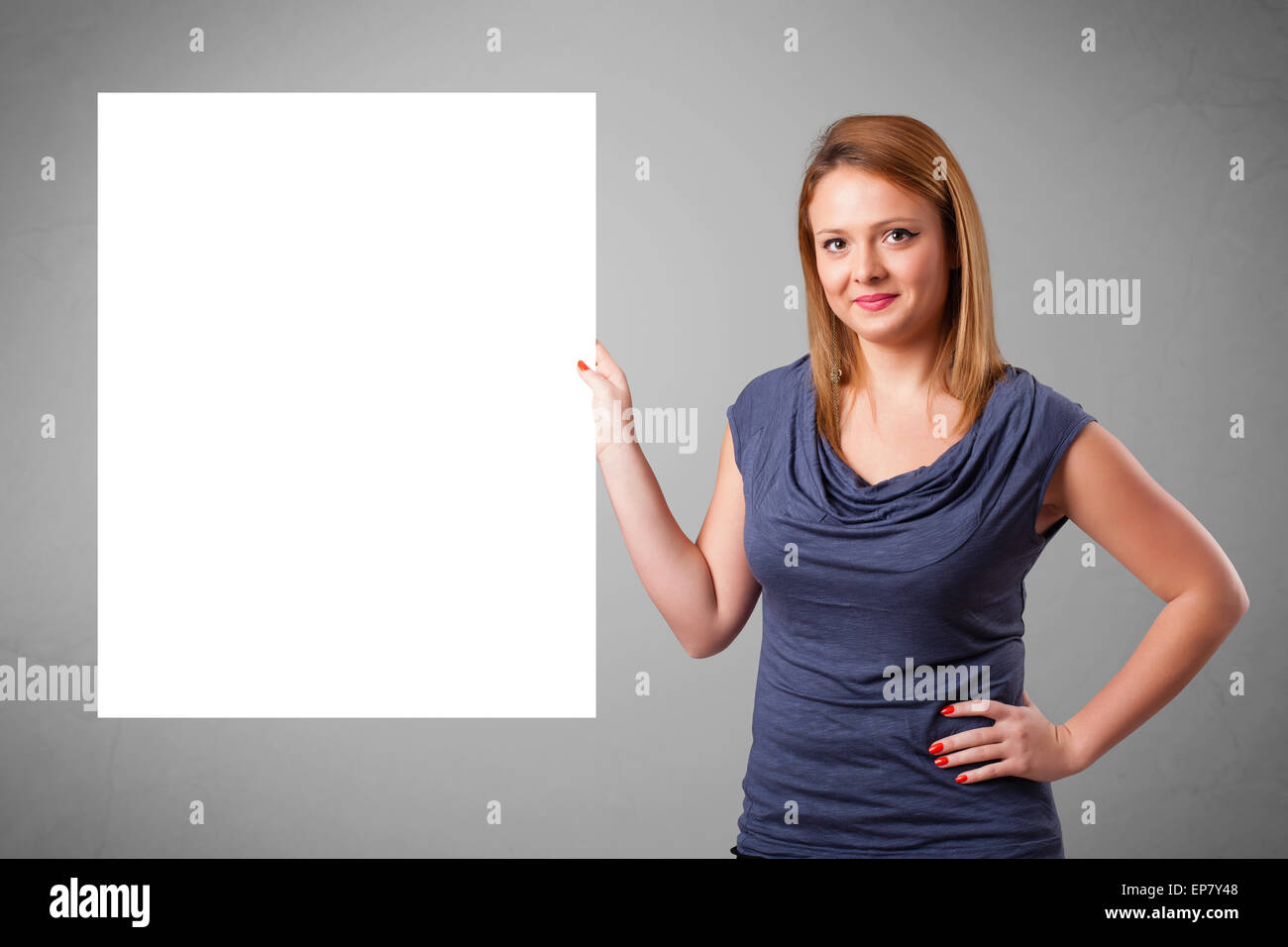 Young woman presenting white paper copy space Stock Photo - Alamy
