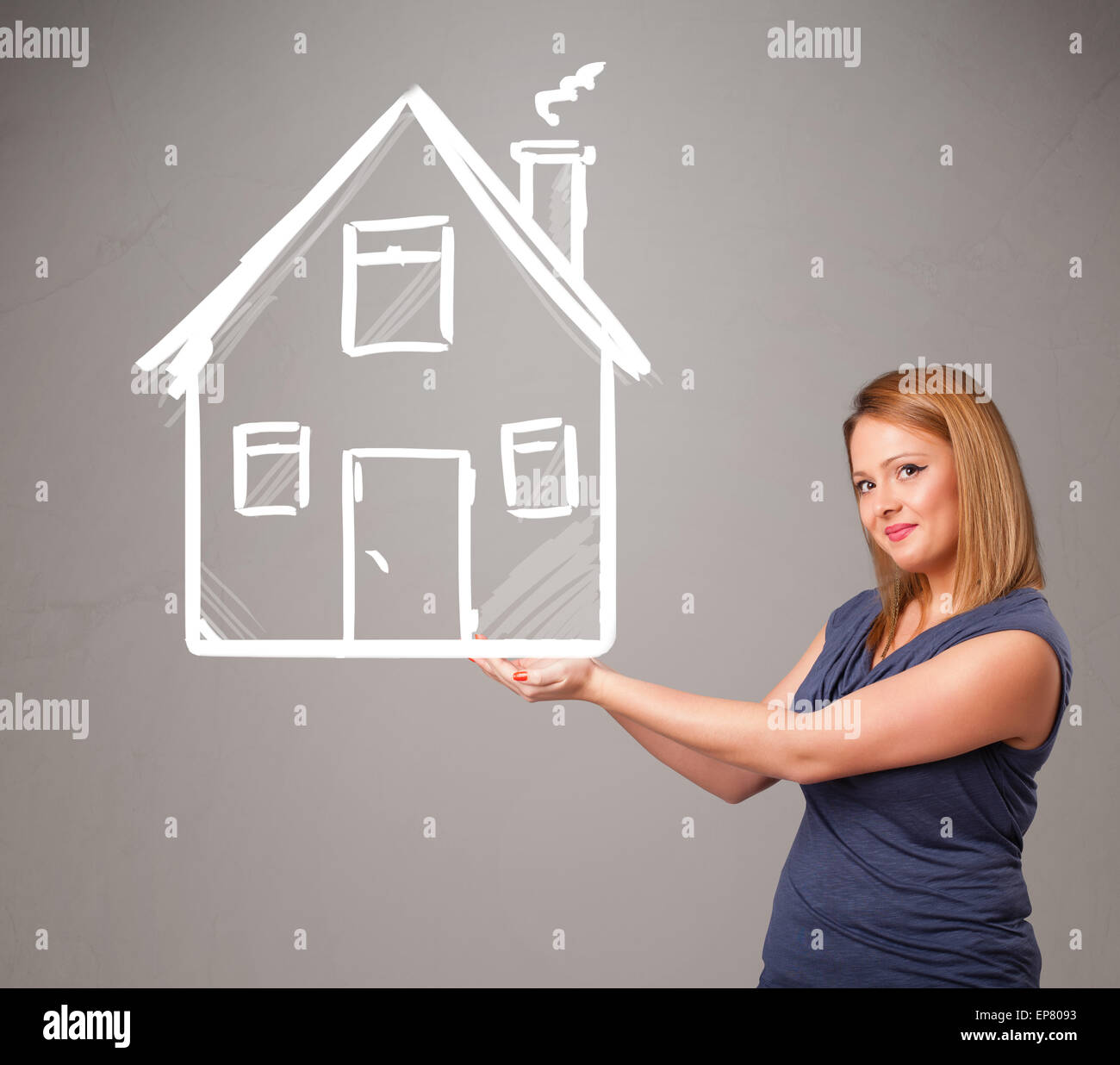 Young lady holding a huge drawn house Stock Photo - Alamy