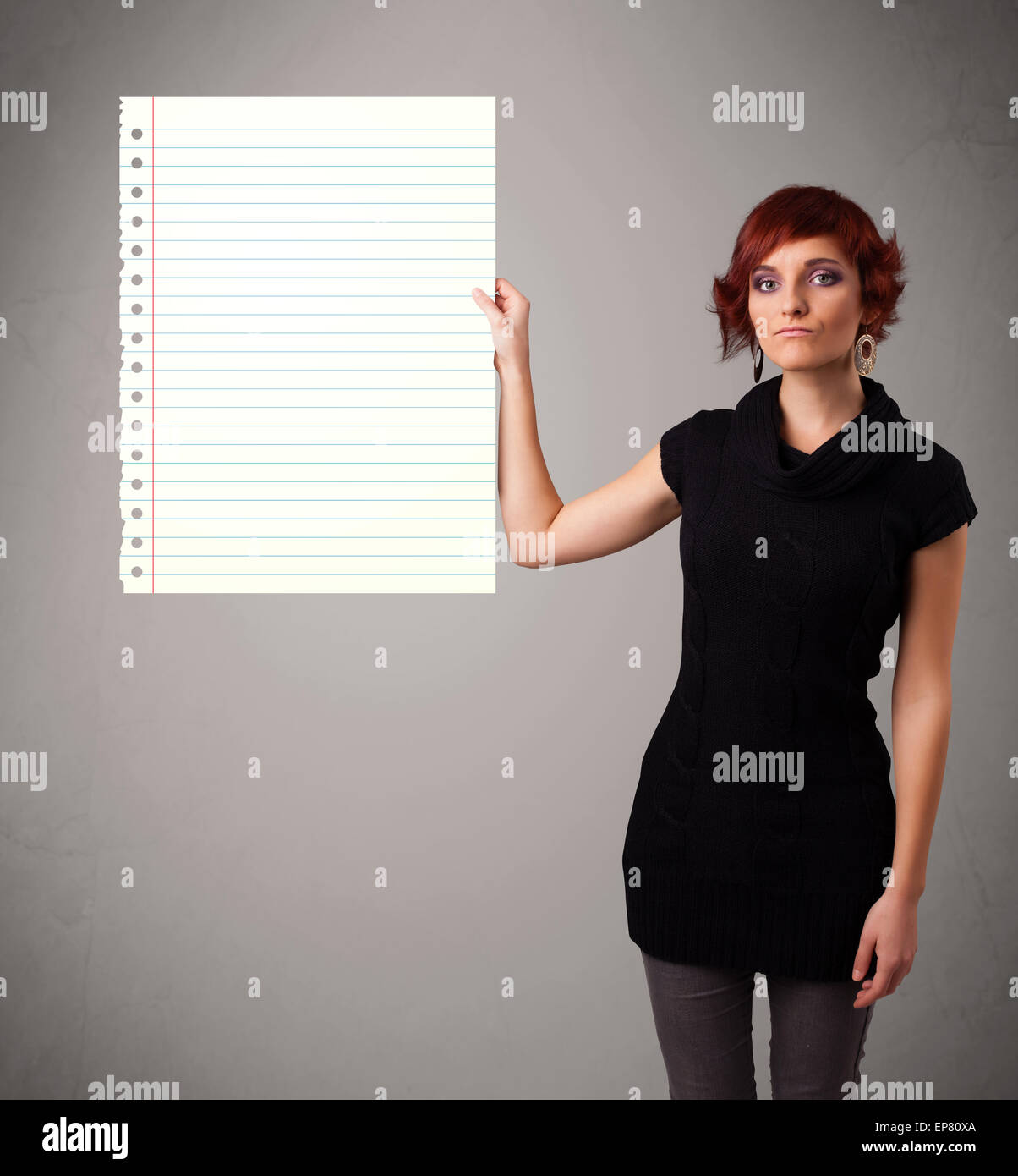 Young woman holding white paper copy space with diagonal lines Stock ...