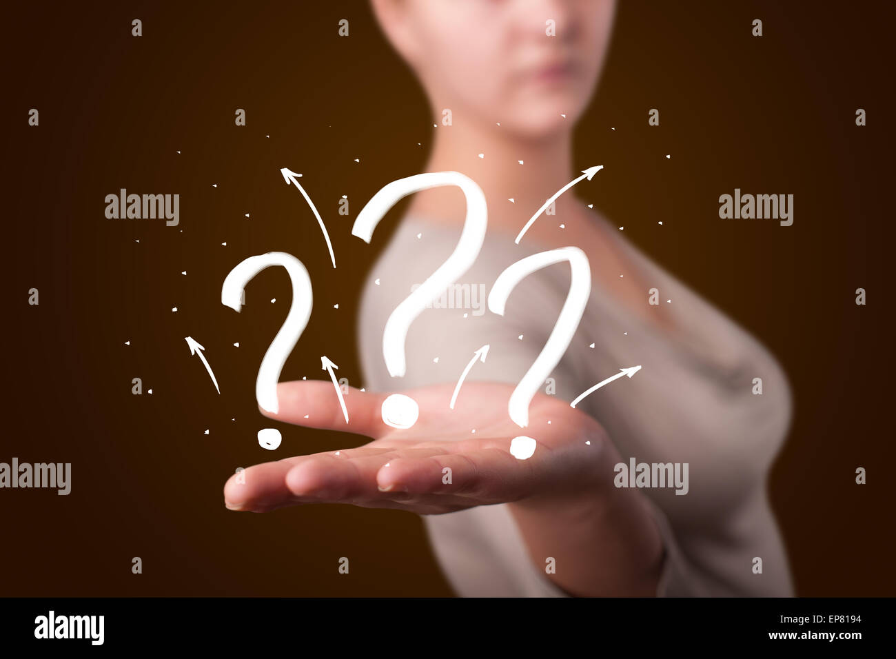 Young woman presenting hand drawn question marks Stock Photo - Alamy