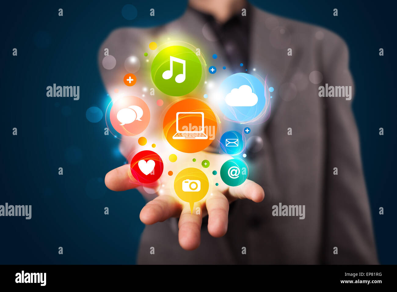 Young businessman presenting colorful technology icons and symbols ...