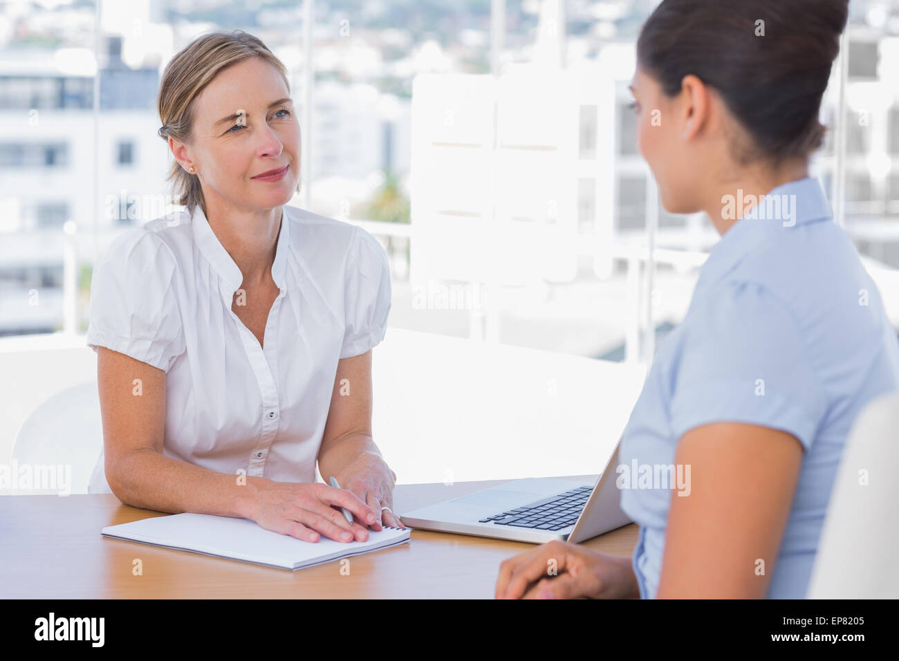 Woman having a job interview with a businesswoman Stock Photo - Alamy