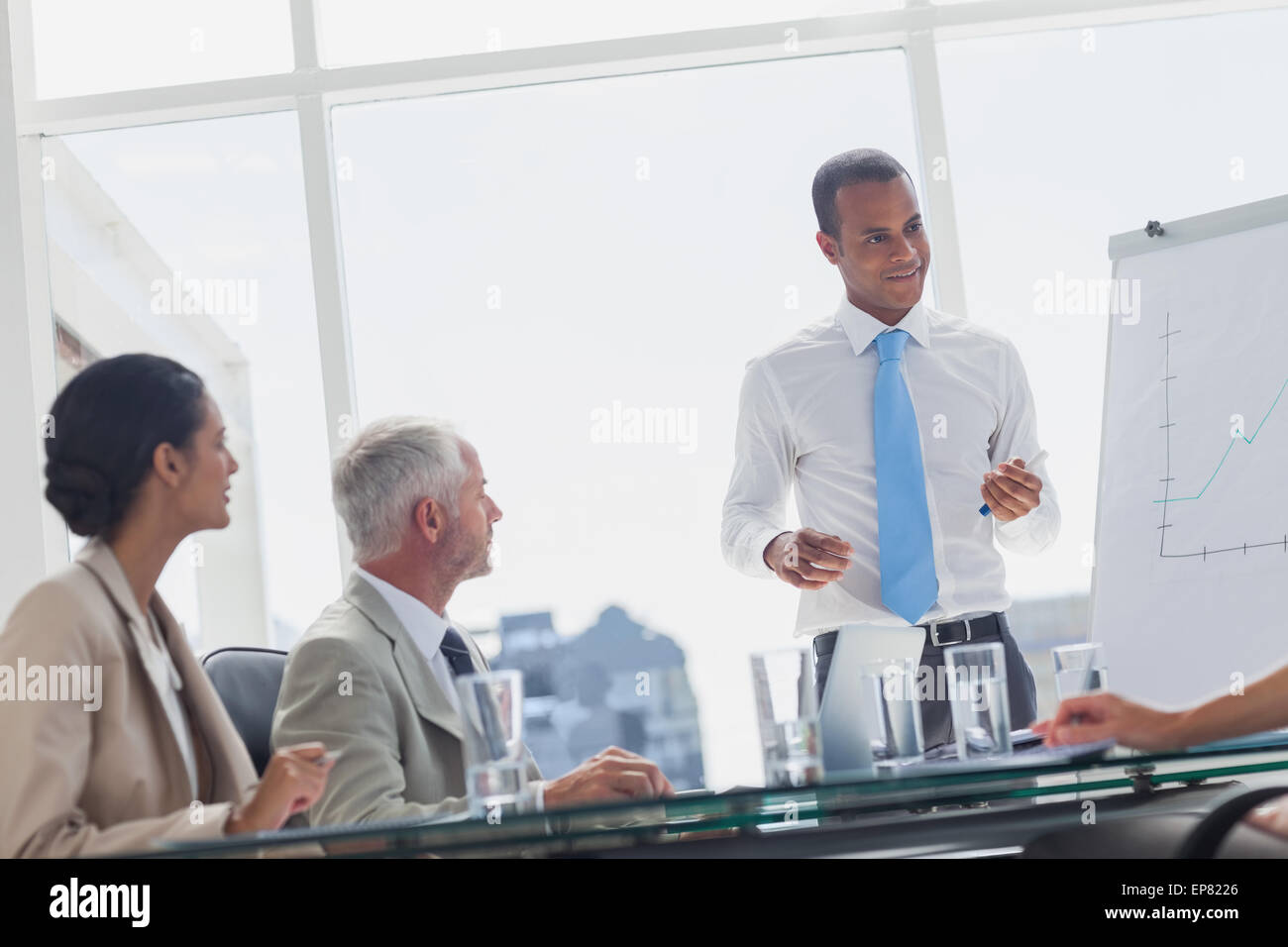 Smiling manager standing in front hi-res stock photography and images ...