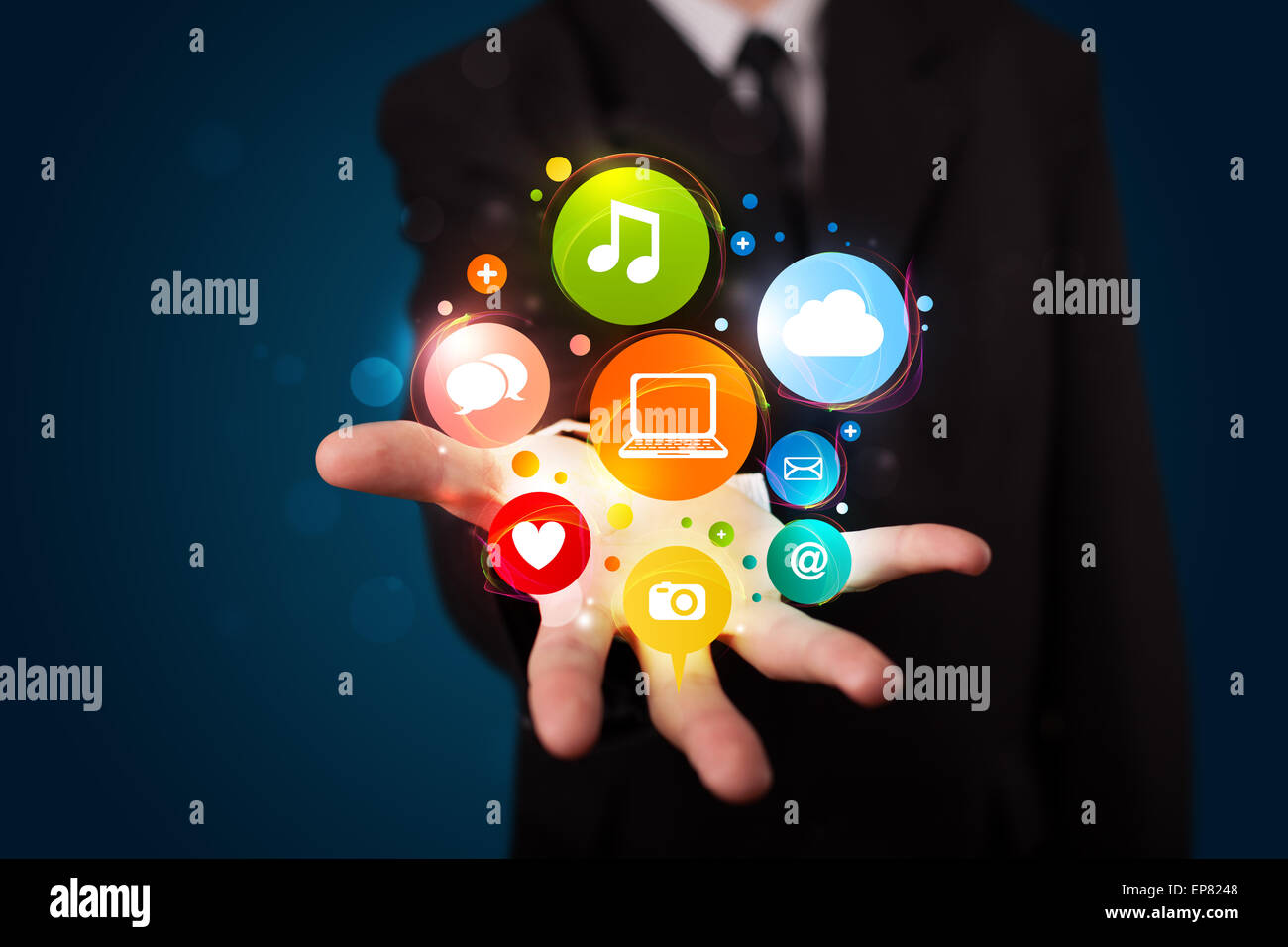 Young businessman presenting colorful technology icons and symbols ...