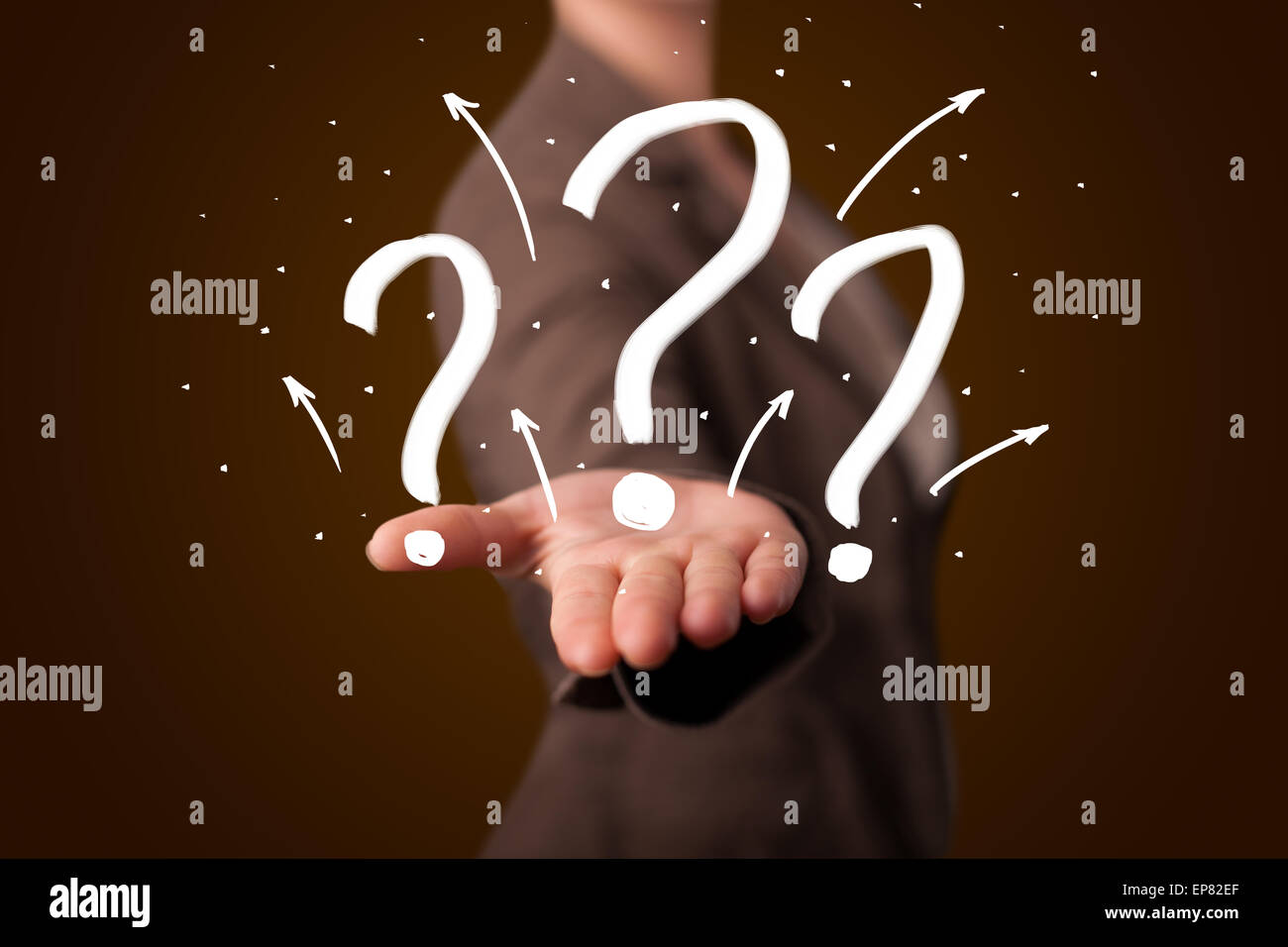 Young woman presenting hand drawn question marks Stock Photo - Alamy