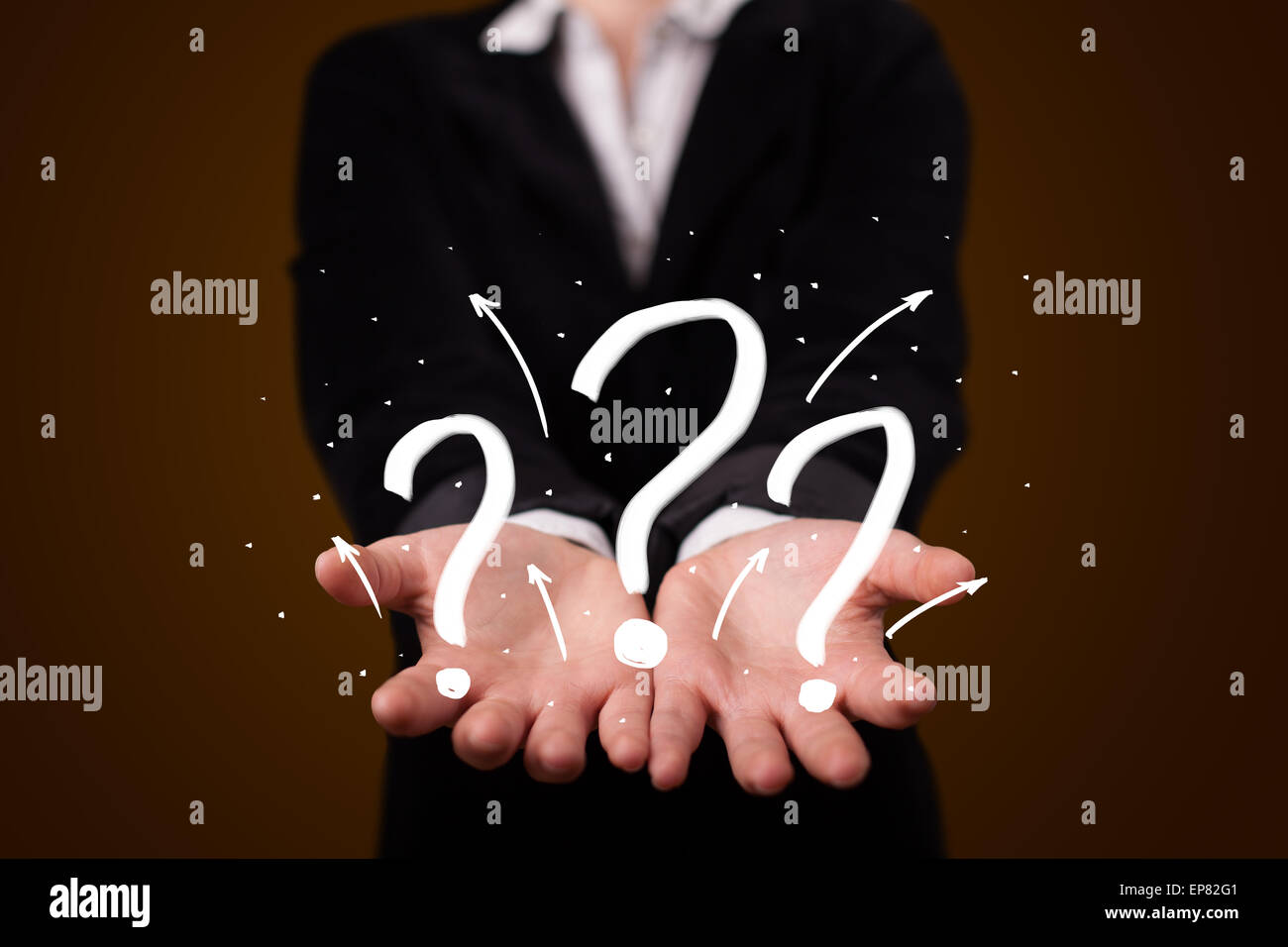 Young woman presenting hand drawn question marks Stock Photo - Alamy