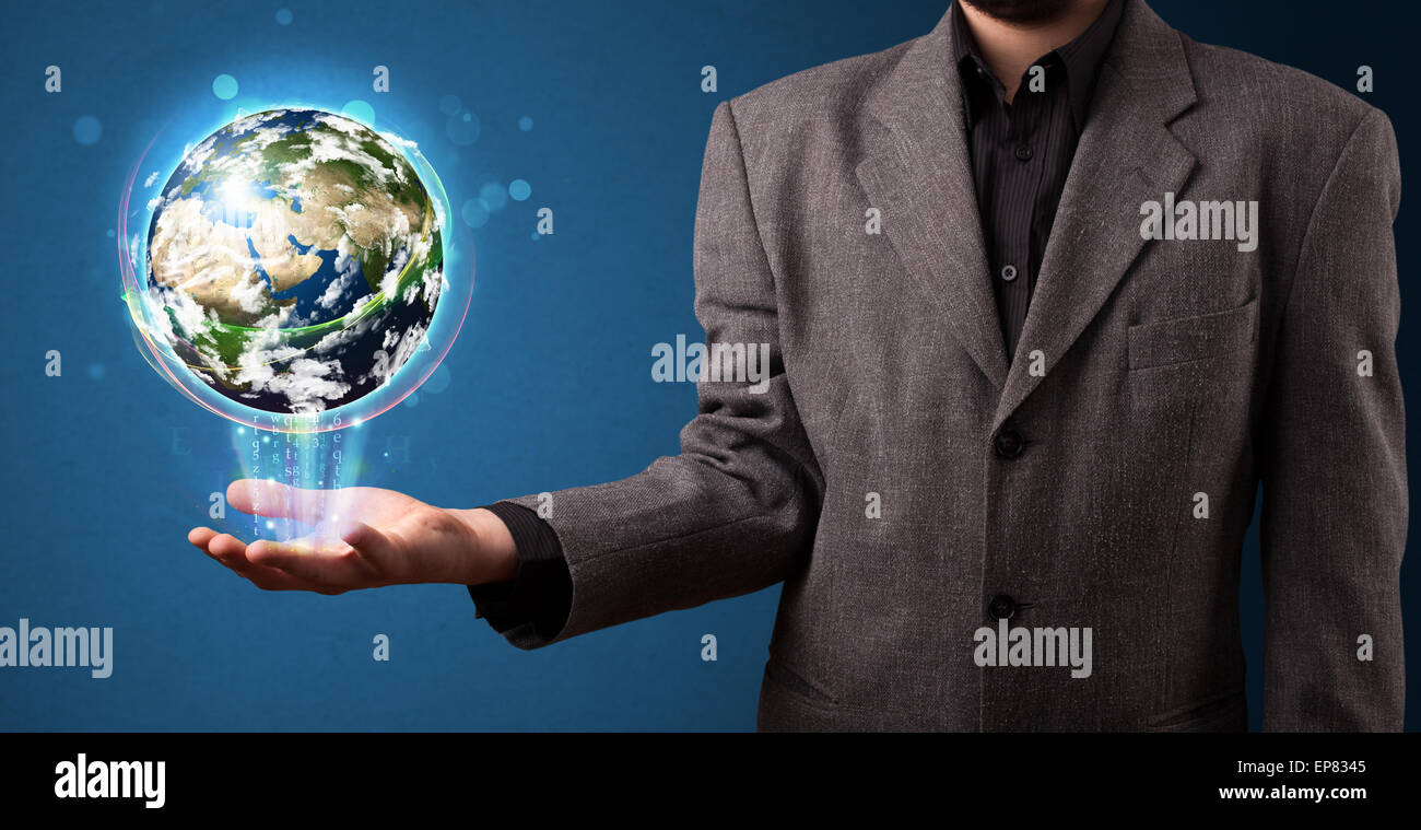 Businessman Holding Glowing Earth Globe Stock Photo Alamy