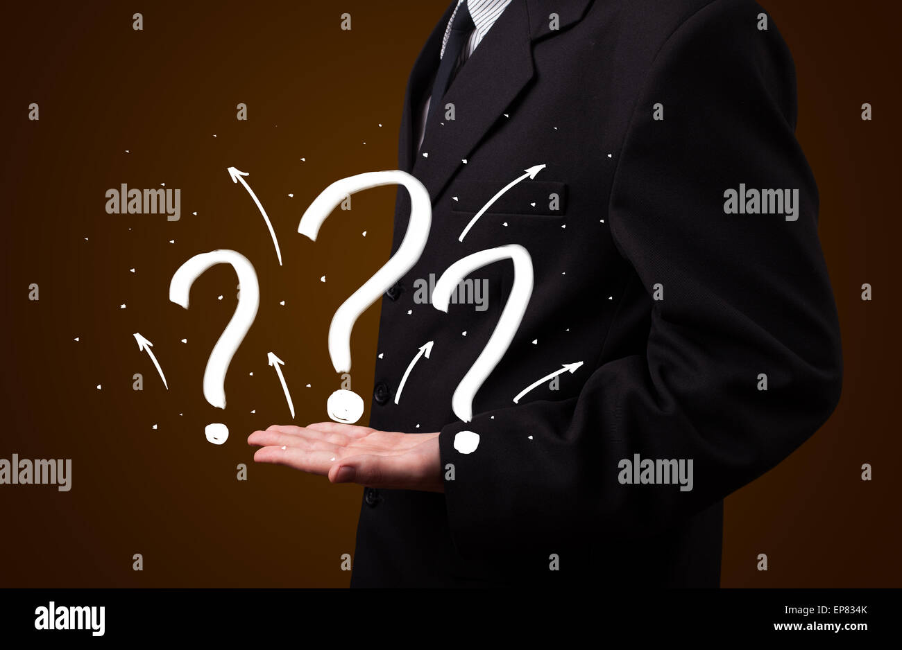 Young businessman presenting hand drawn question marks Stock Photo - Alamy