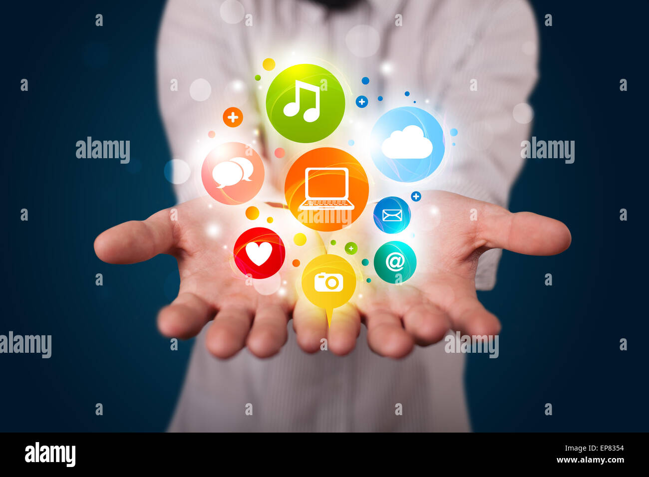 Young businessman presenting colorful technology icons and symbols ...