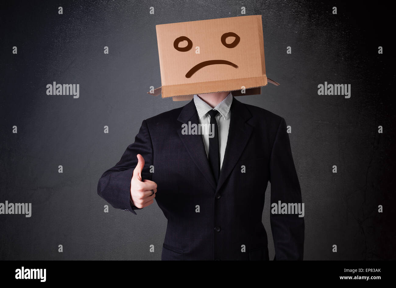 Young man with a brown cardboard box on his head with sad face Stock ...