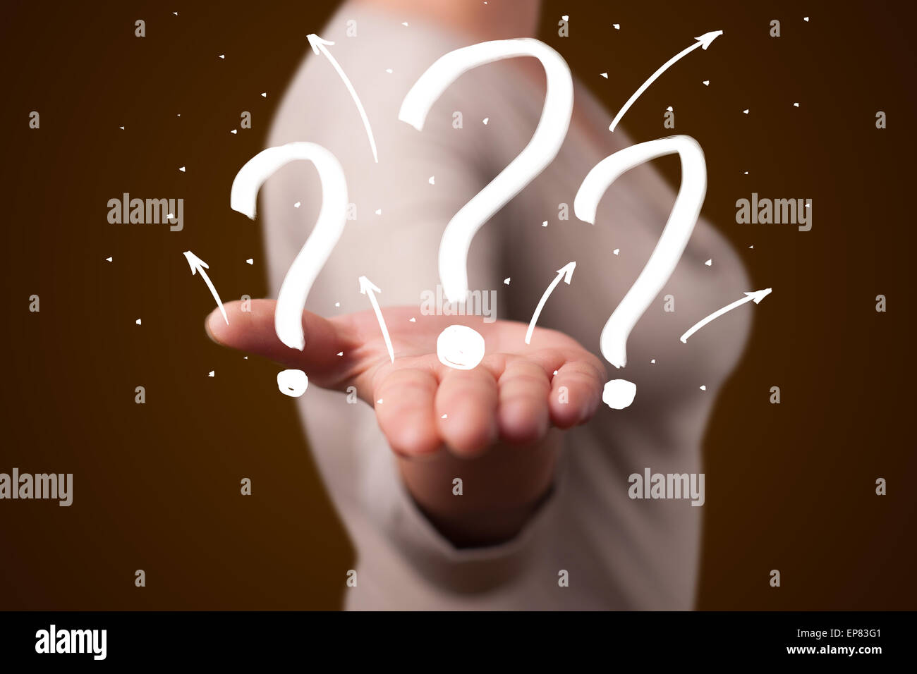 Young woman presenting hand drawn question marks Stock Photo - Alamy