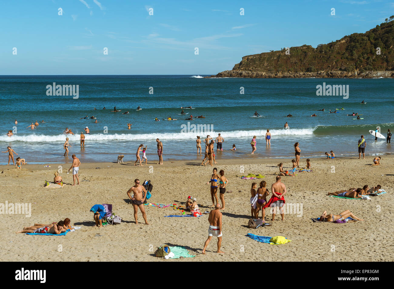 People sunbathing on Zurriola beach, San Sebastian, Donostia, Basque ...