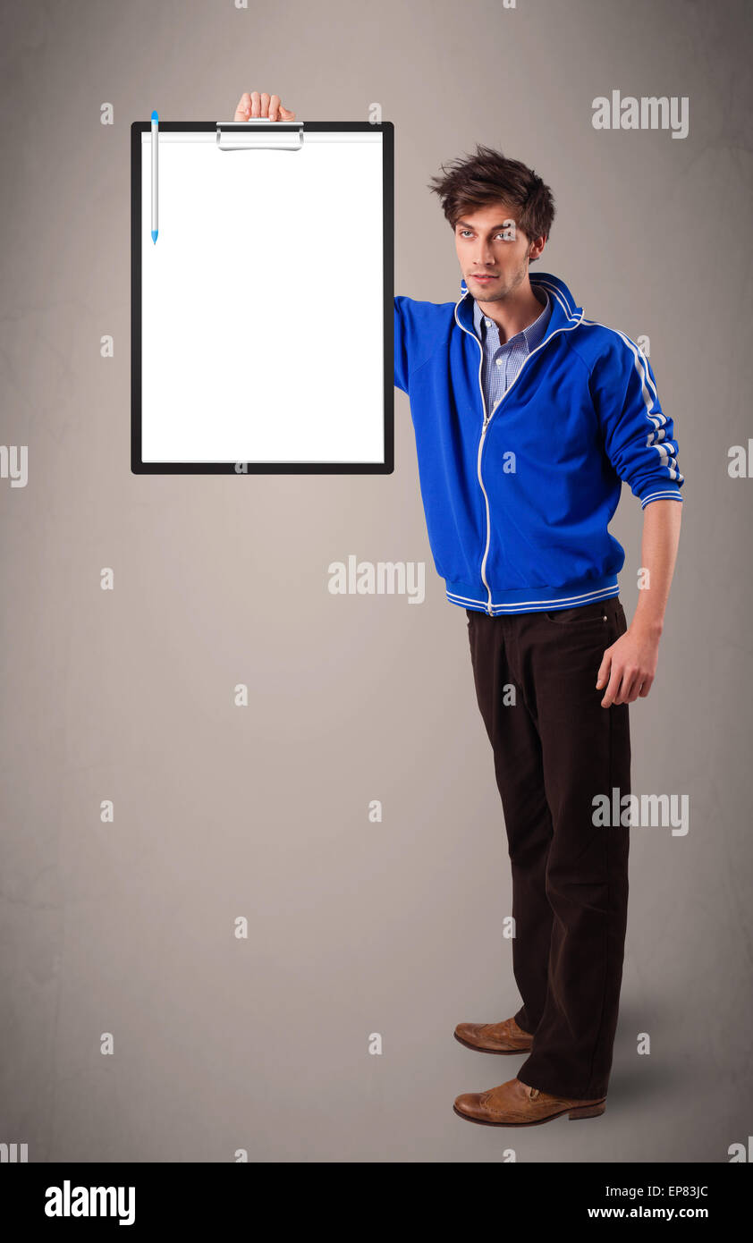 Young boy holding black folder with white sheet copy space Stock Photo ...