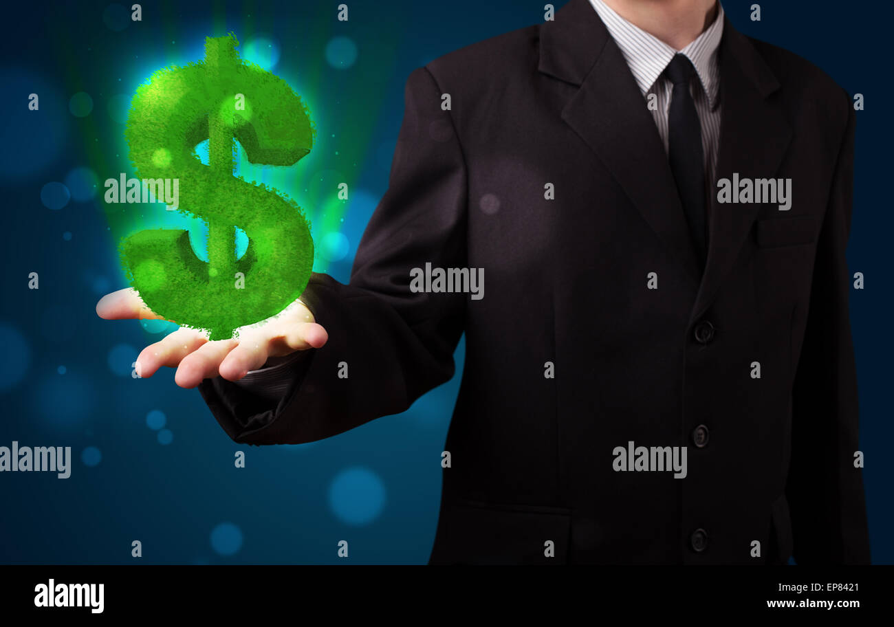 Young businessman presenting green glowing dollar sign Stock Photo - Alamy Young businessman presenting green glowing dollar sign Stock Photo - Alamy
