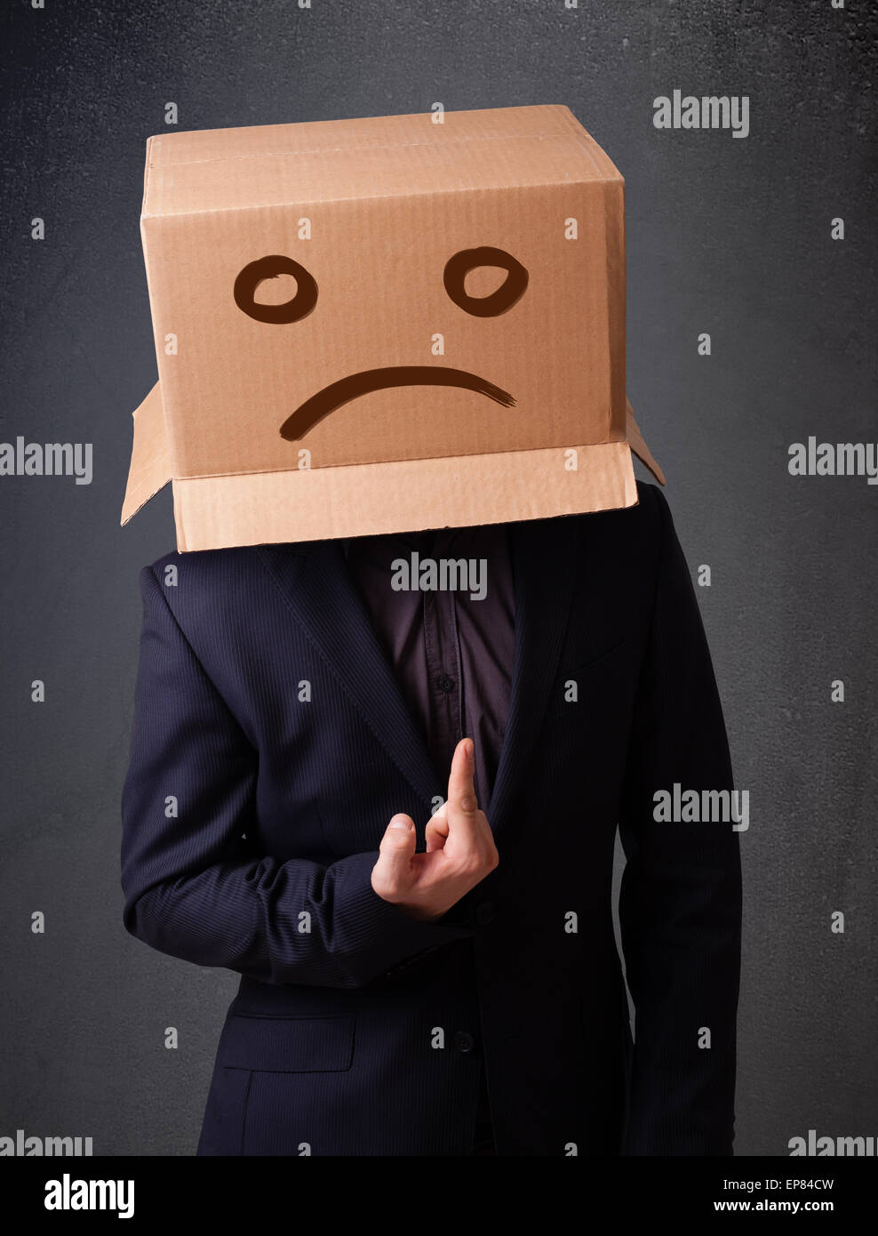 Young man with a brown cardboard box on his head with sad face Stock ...