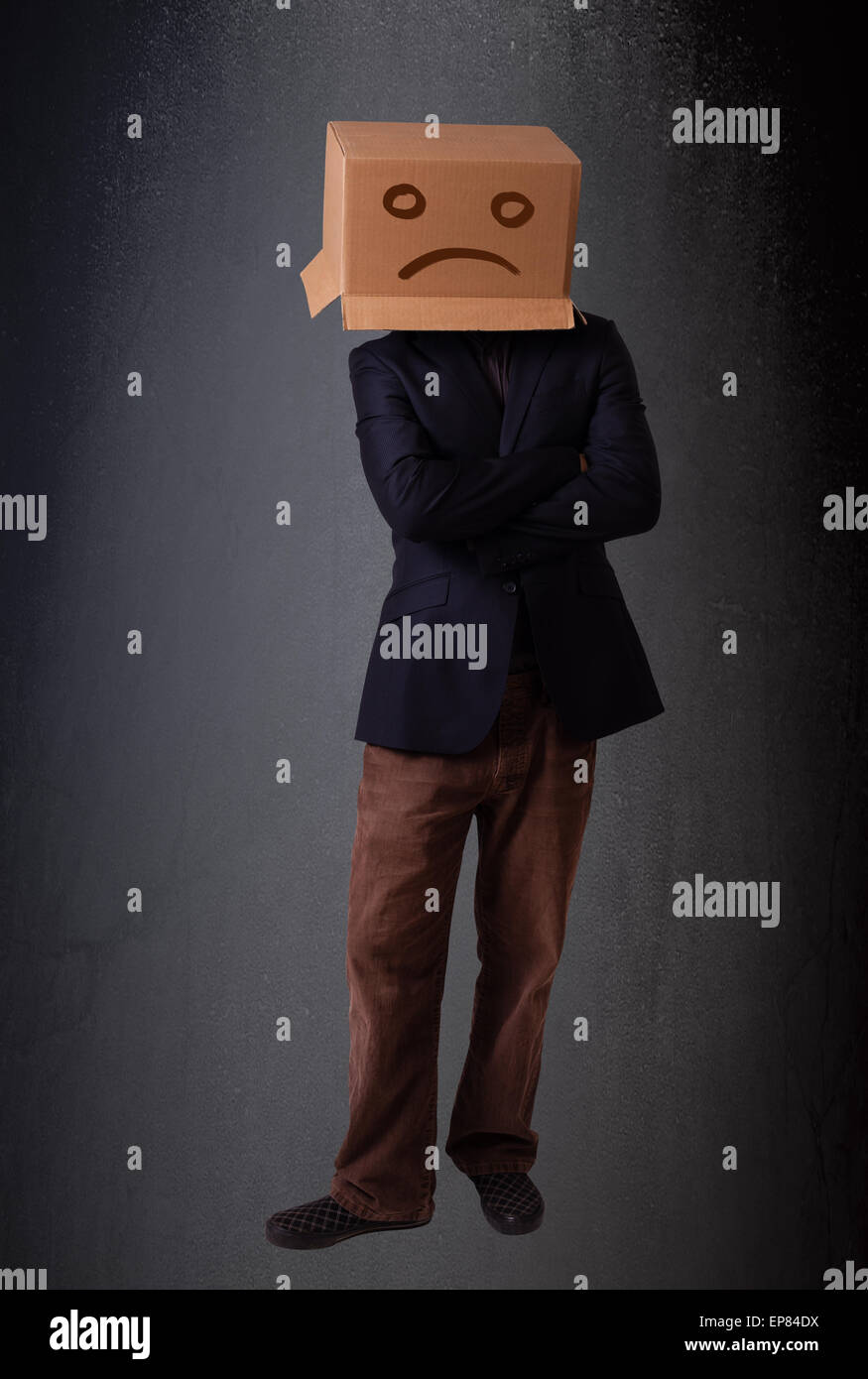 Young man with a brown cardboard box on his head with sad face Stock ...