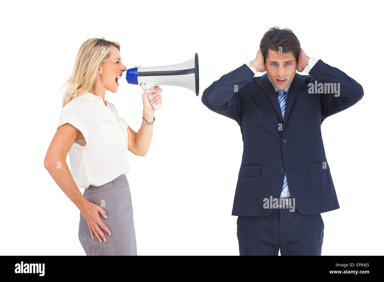 Businessman with hands on his ears because of megaphone Stock Photo - Alamy