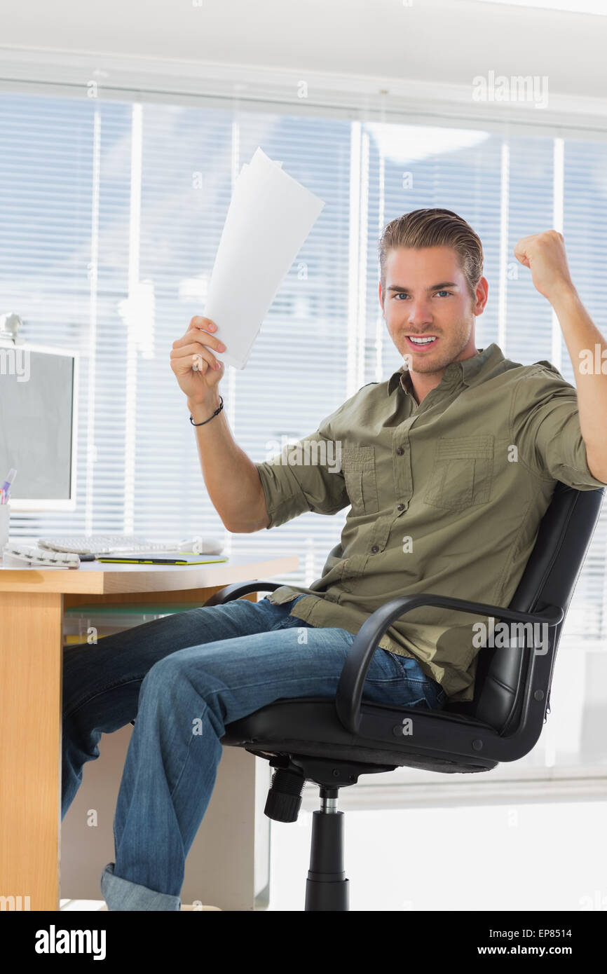 Cheerful creative business employee raising arms Stock Photo - Alamy