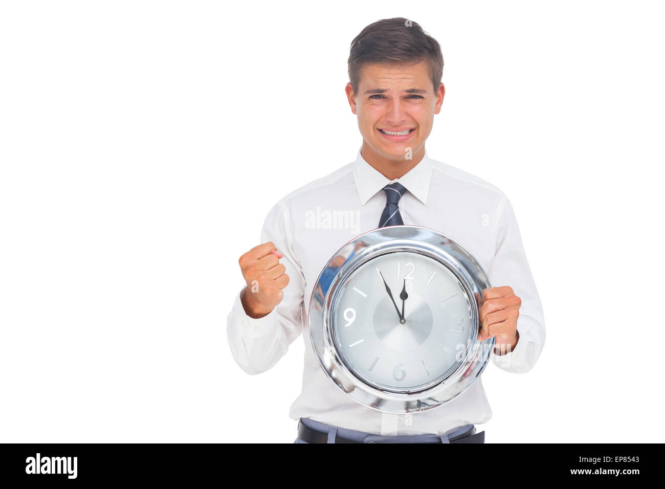 Fearful businessman holding and looking at clock Stock Photo - Alamy