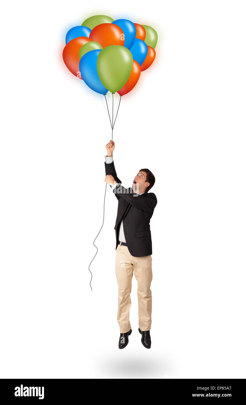 Handsome man holding colorful balloons Stock Photo - Alamy