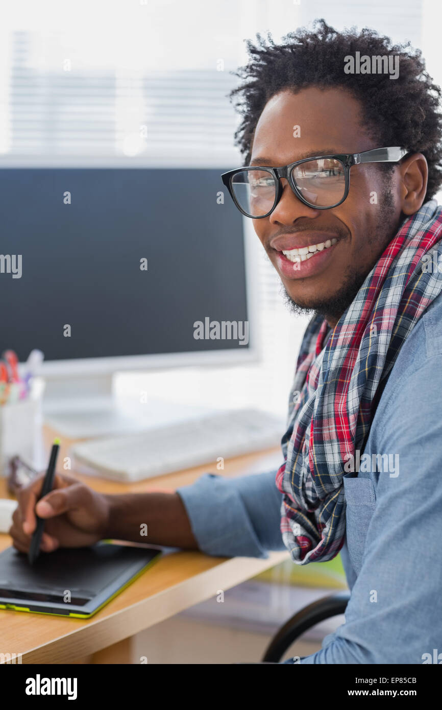 Cheerful graphic designer using a graphics tablet Stock Photo - Alamy