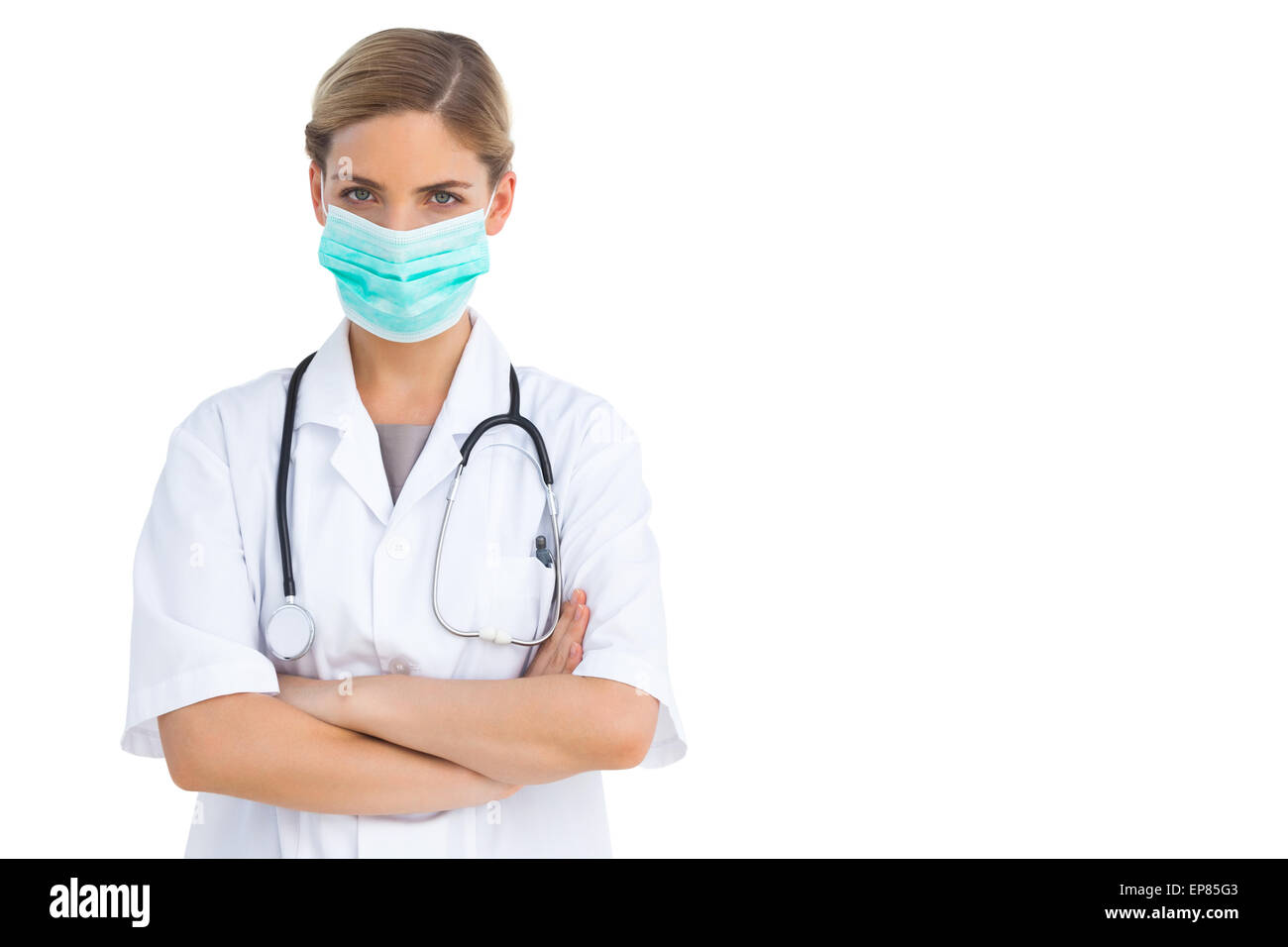 Nurse wearing protective mask with arms crossed Stock Photo - Alamy
