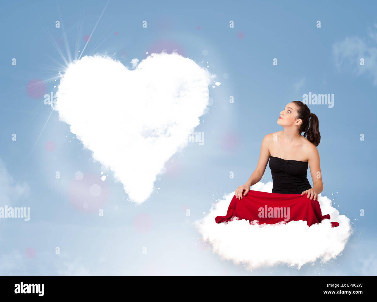 Beautiful lovely woman sitting on cloud with heart Stock Photo - Alamy
