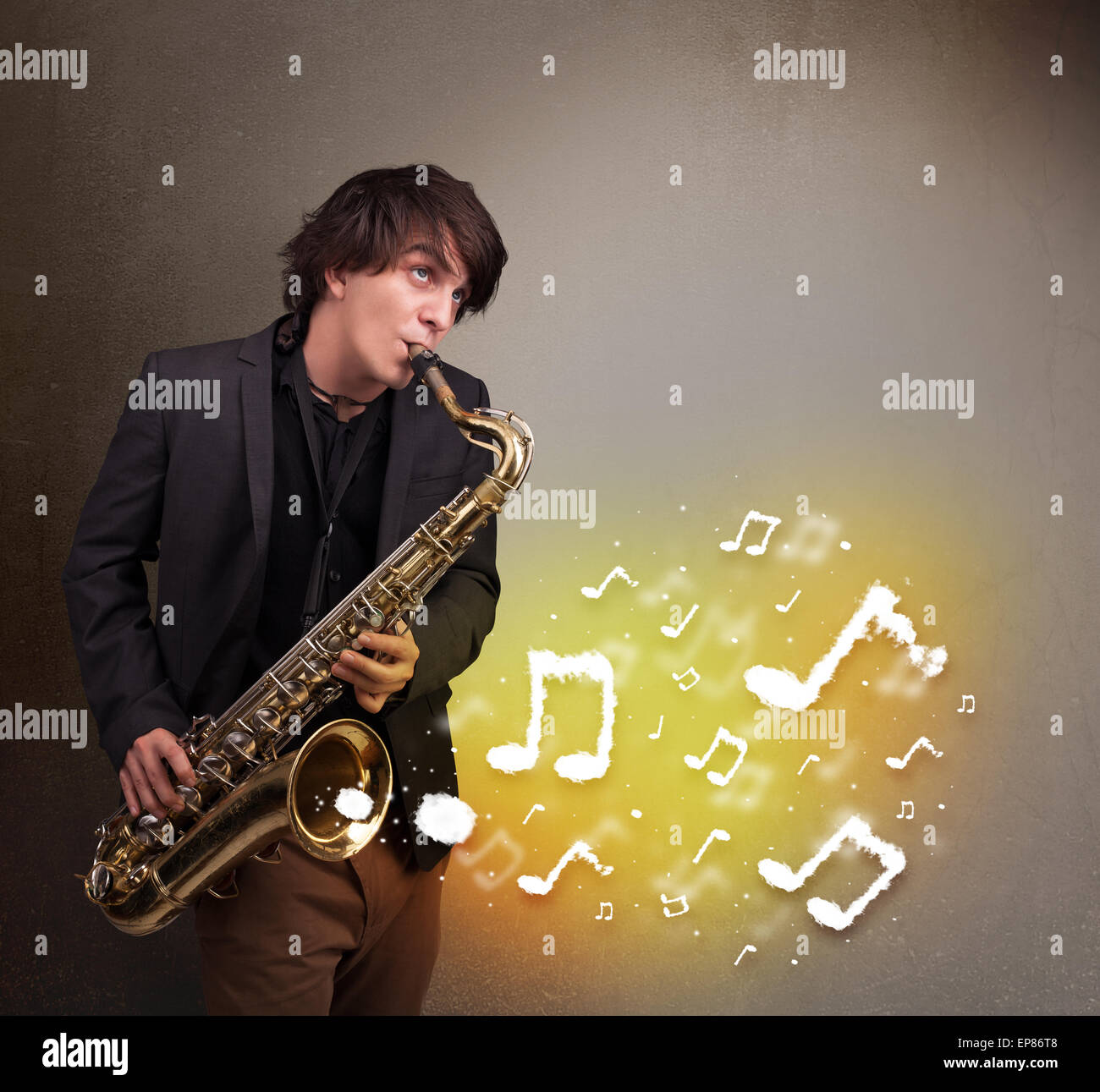 Handsome musician playing on saxophone with musical notes Stock Photo ...