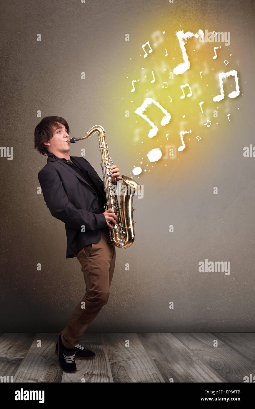 Handsome musician playing on saxophone with musical notes Stock Photo ...