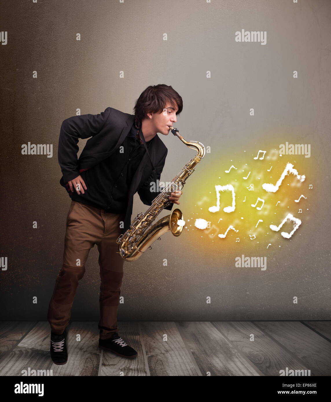 Handsome musician playing on saxophone with musical notes Stock Photo ...