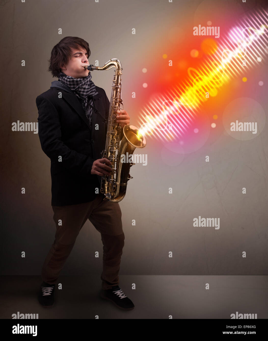 Young man playing on saxophone with colorful sound waves Stock Photo ...