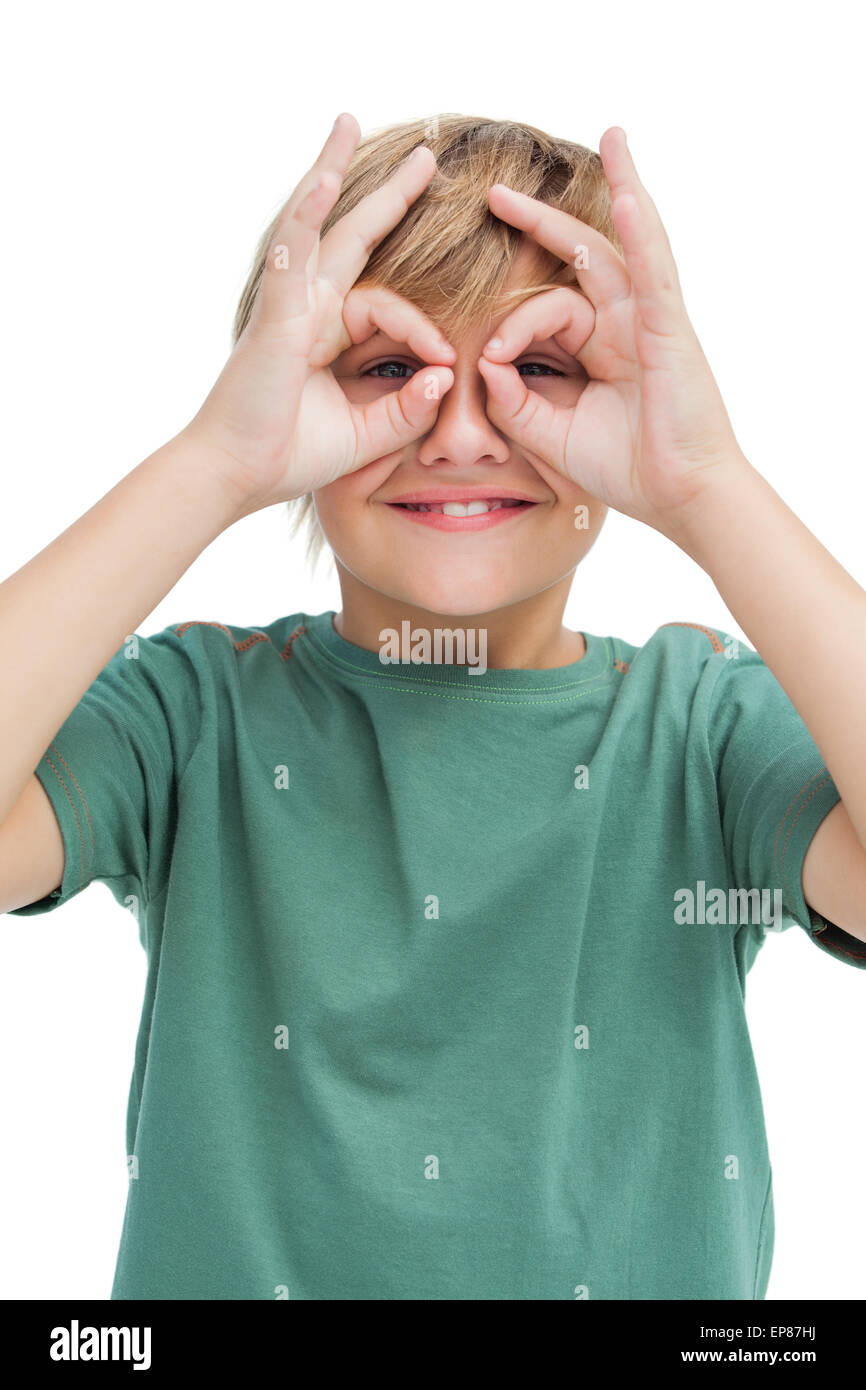 Happy little guy making goggles with his fingers Stock Photo - Alamy