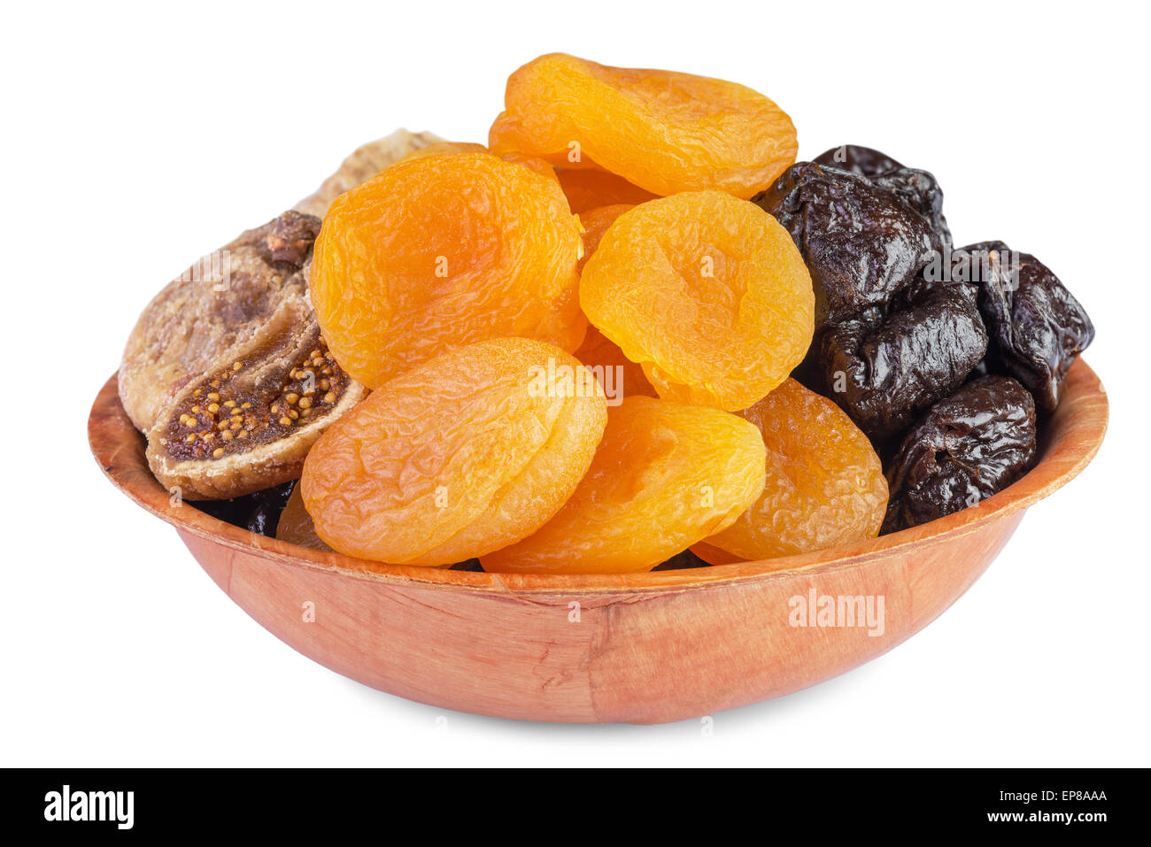Dried pitted fruits in wooden bowl isolated on white background Stock ...