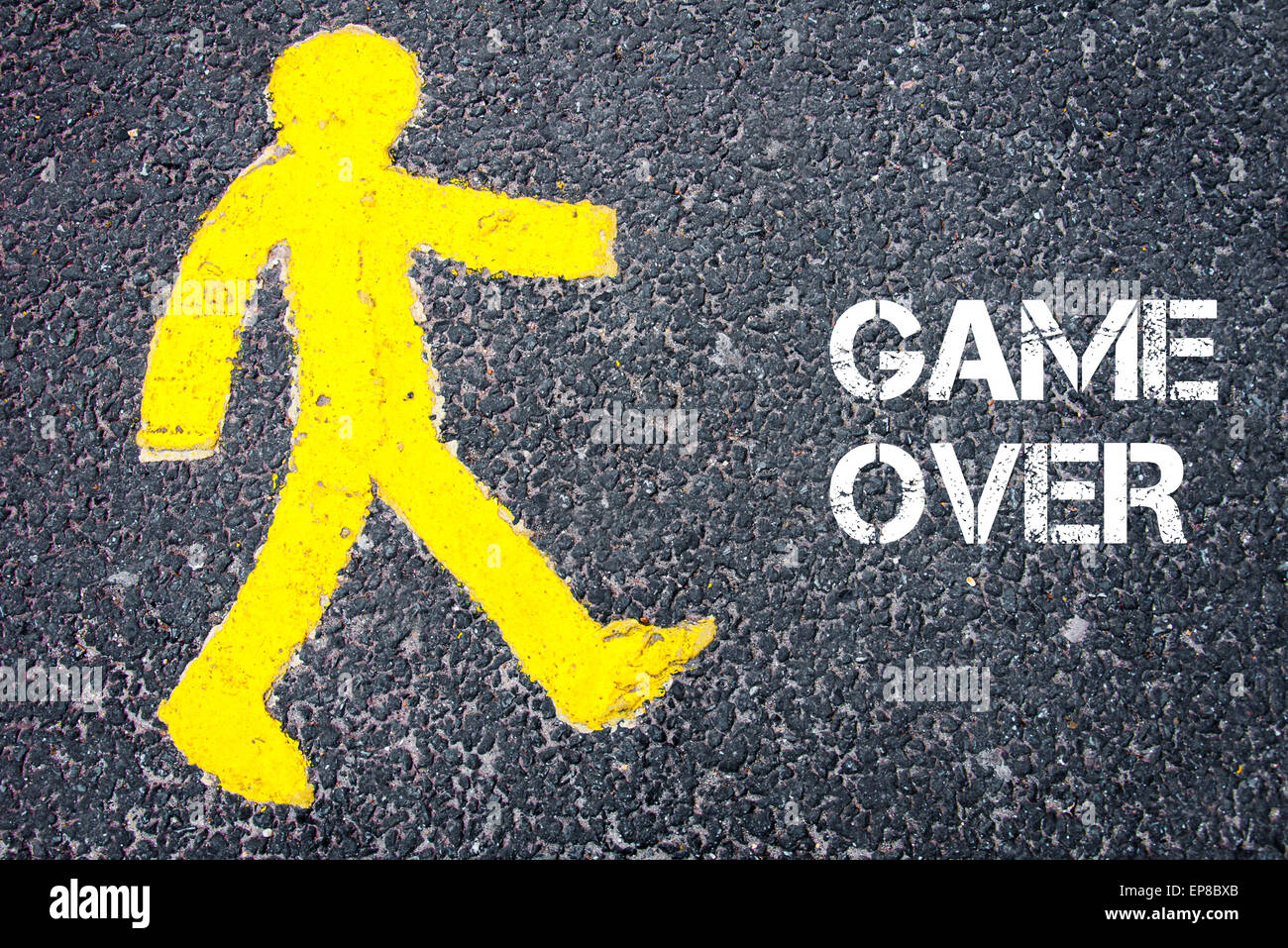 Yellow pedestrian figure on the road walking towards GAME OVER ...