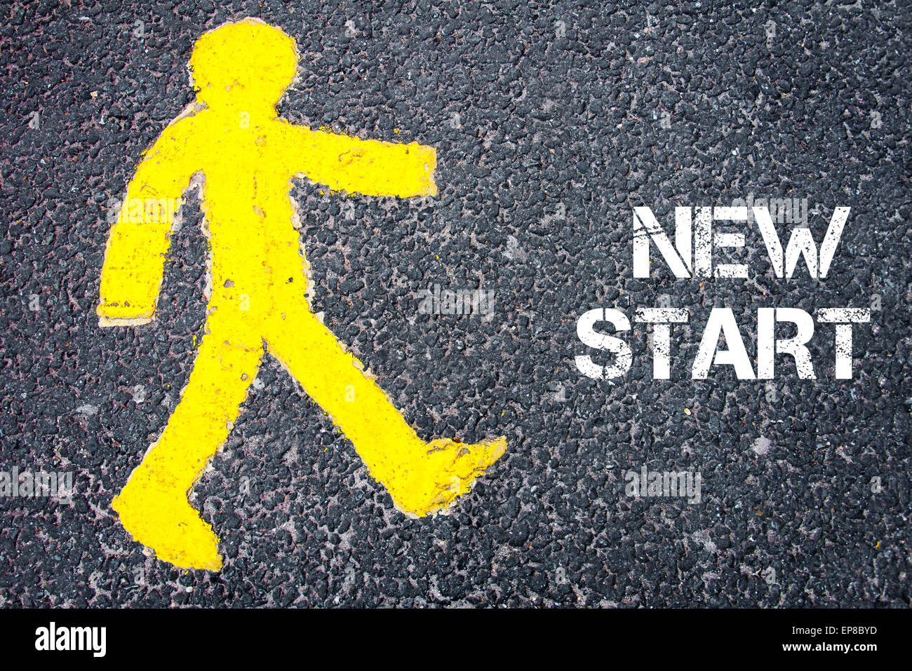 Yellow pedestrian figure on the road walking towards NEW START ...