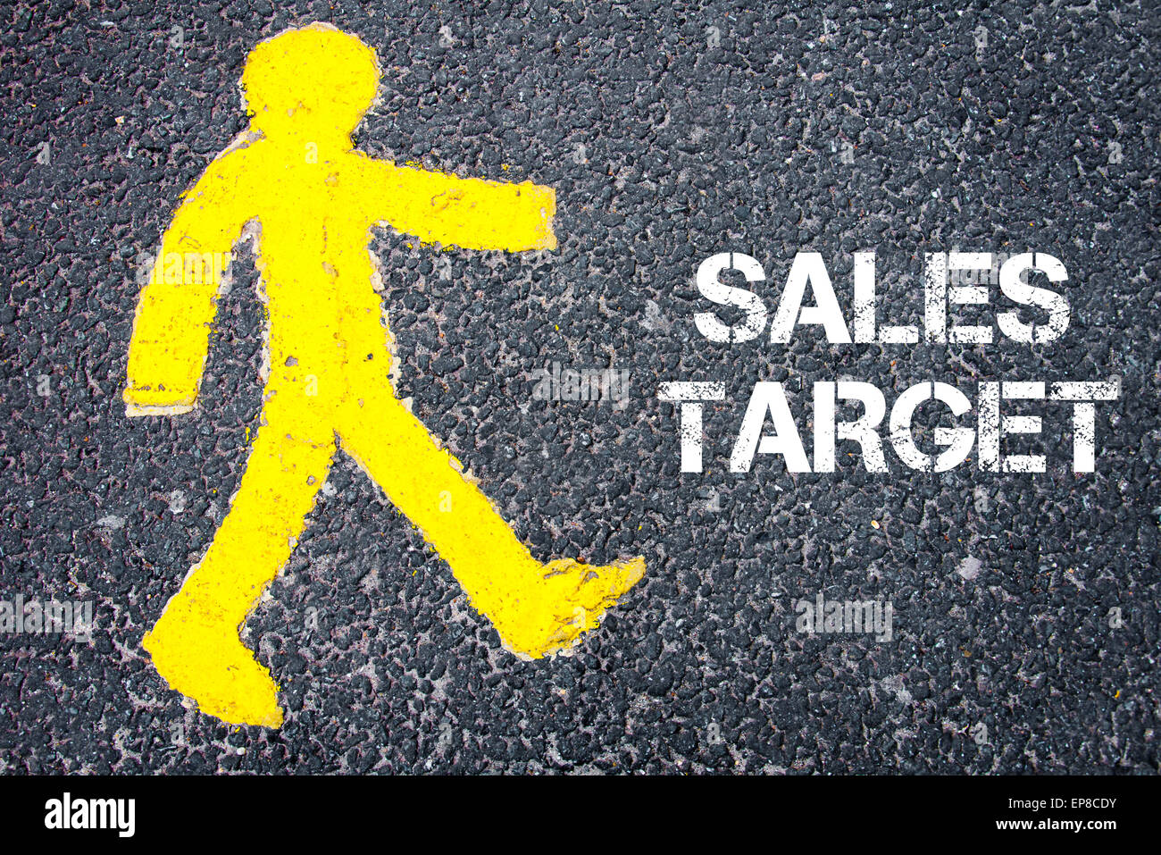 Yellow pedestrian figure on the road walking towards SALES TARGET ...