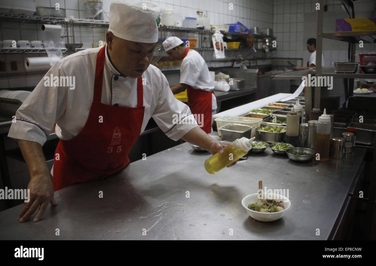 Quito. 13th May, 2015. Image taken on May 13, 2015 shows cooks working ...