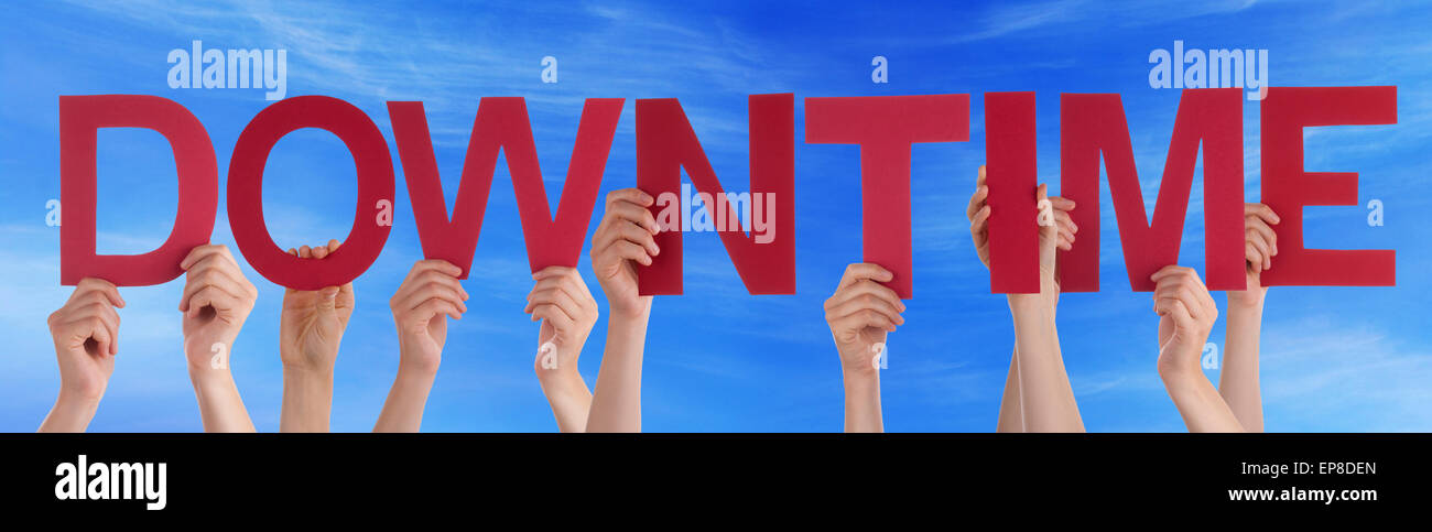 Hands Holding Red Straight Word Downtime Blue Sky Stock Photo - Alamy